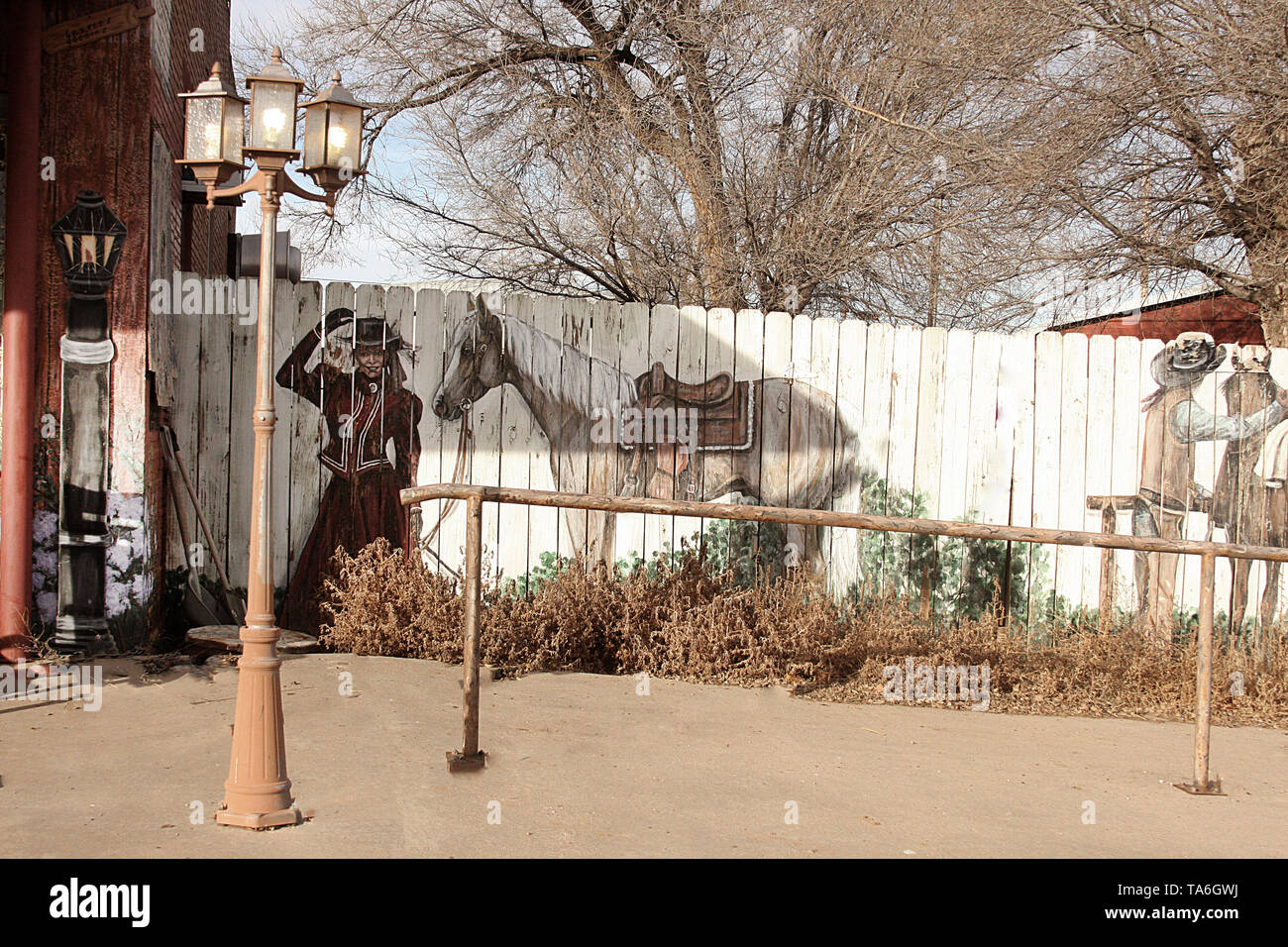 Cowgirl on fence hi-res stock photography and images - Alamy