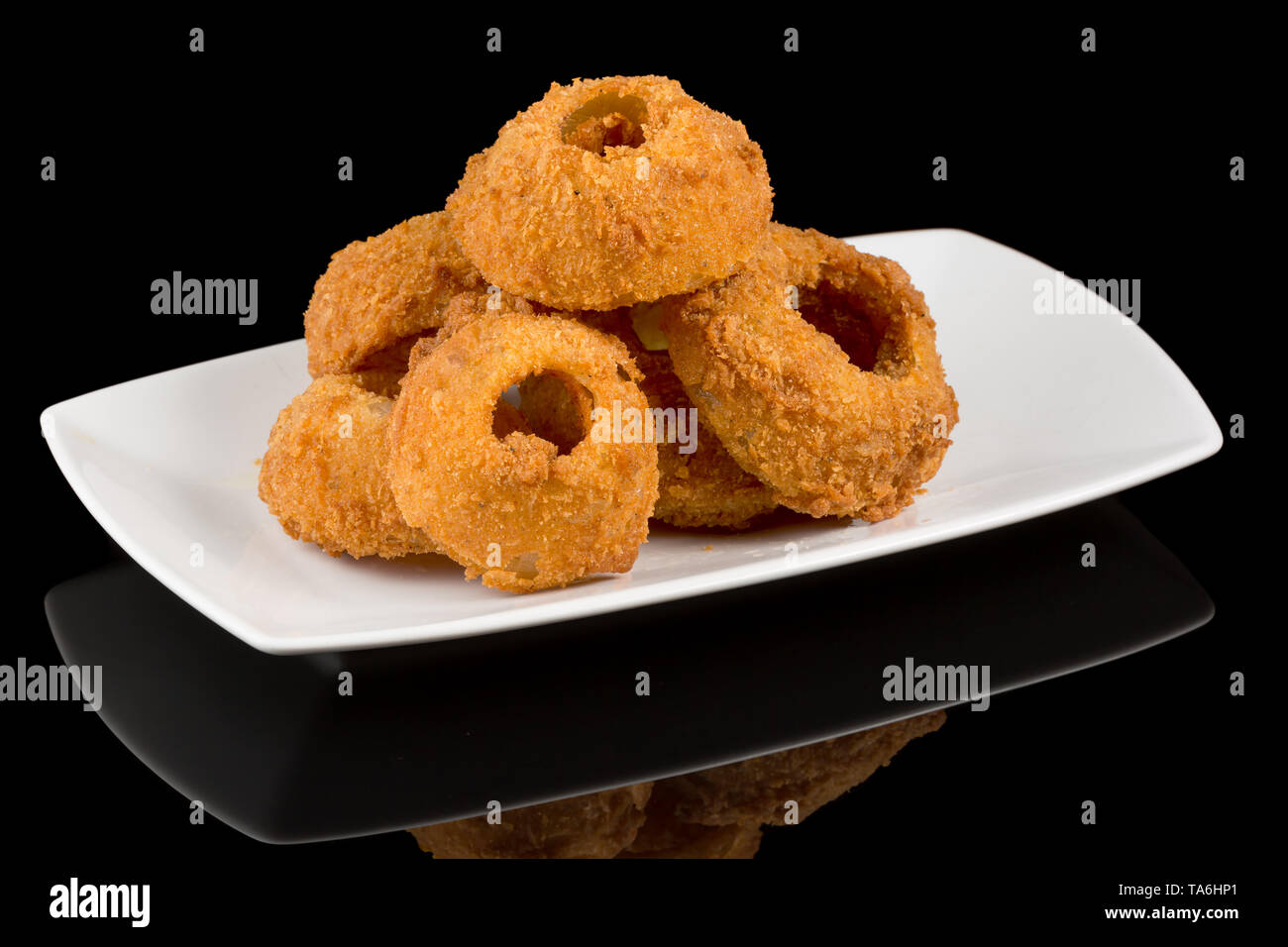 Onion rings isolated on black background with reflection. Studio shot ...