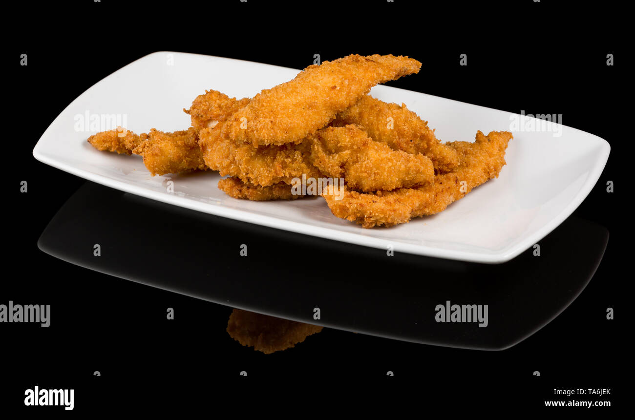 FISH STICKS isolated on black background with reflection. Studio shot ...