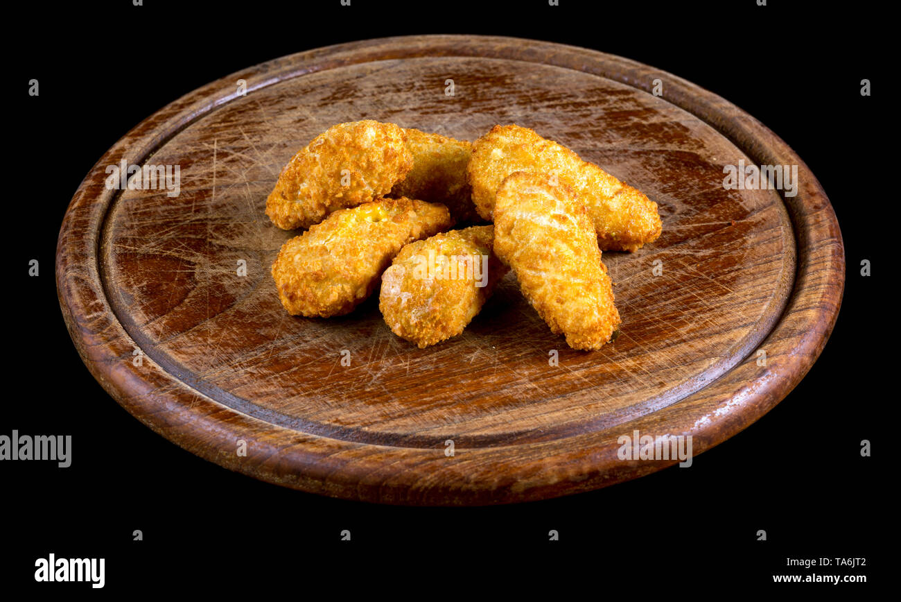 FISH STICKS isolated on black background with reflection. Studio shot ...