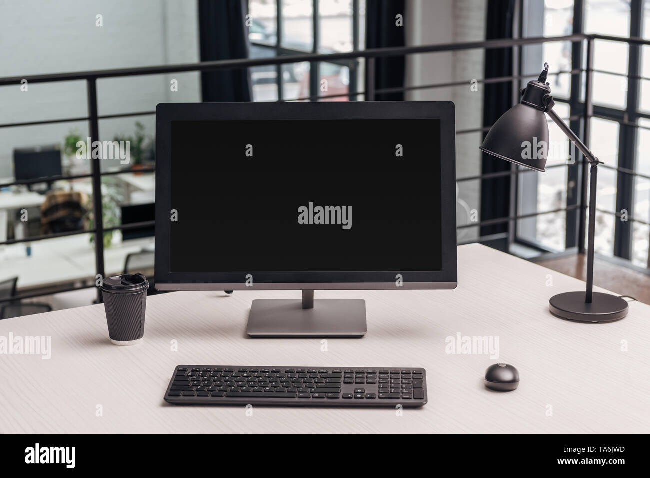 modern workplace with computer, coffee to go and lamp in office Stock ...