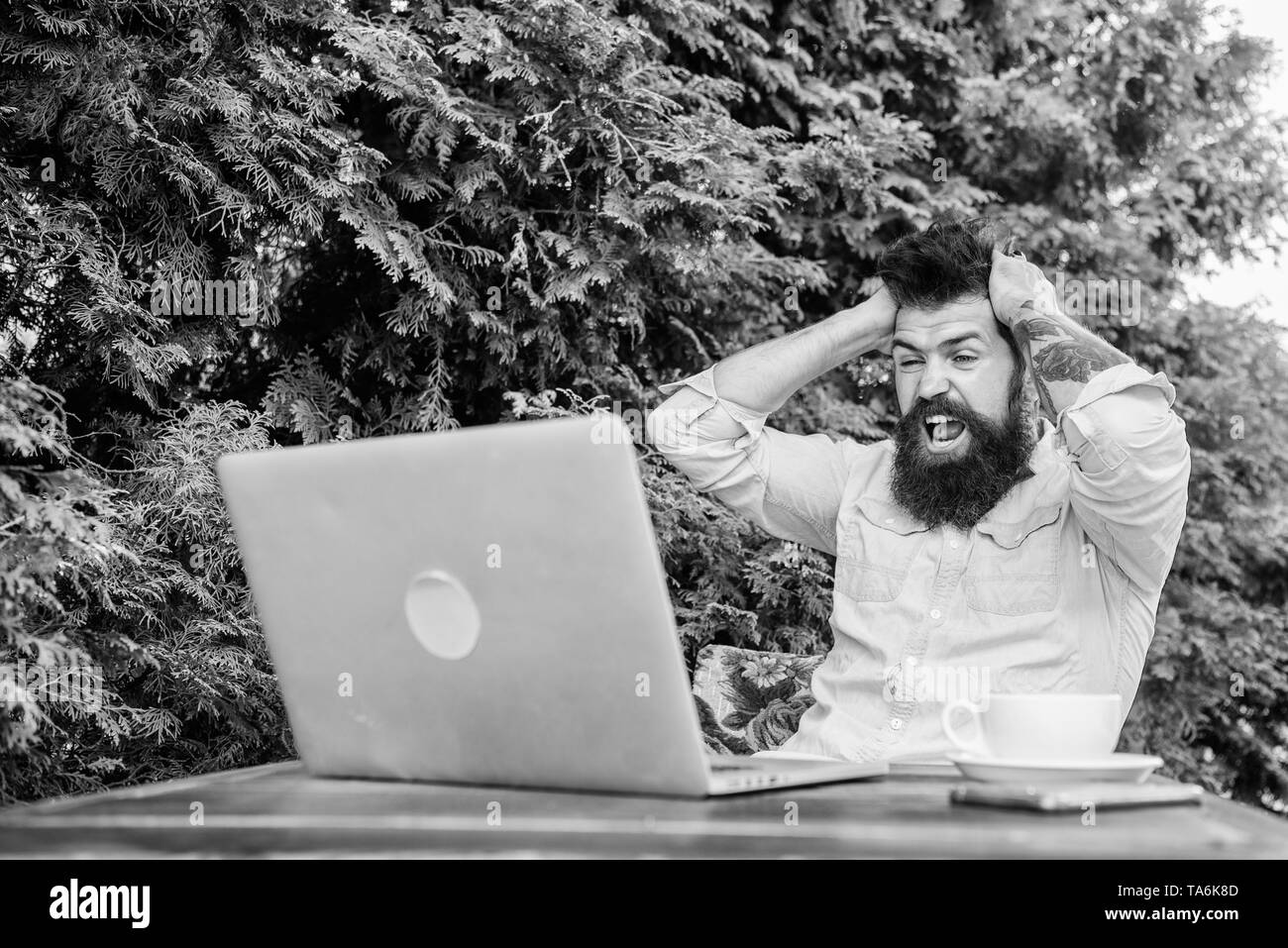 Computer game addict. Gamer participating in pc game played on laptop ...