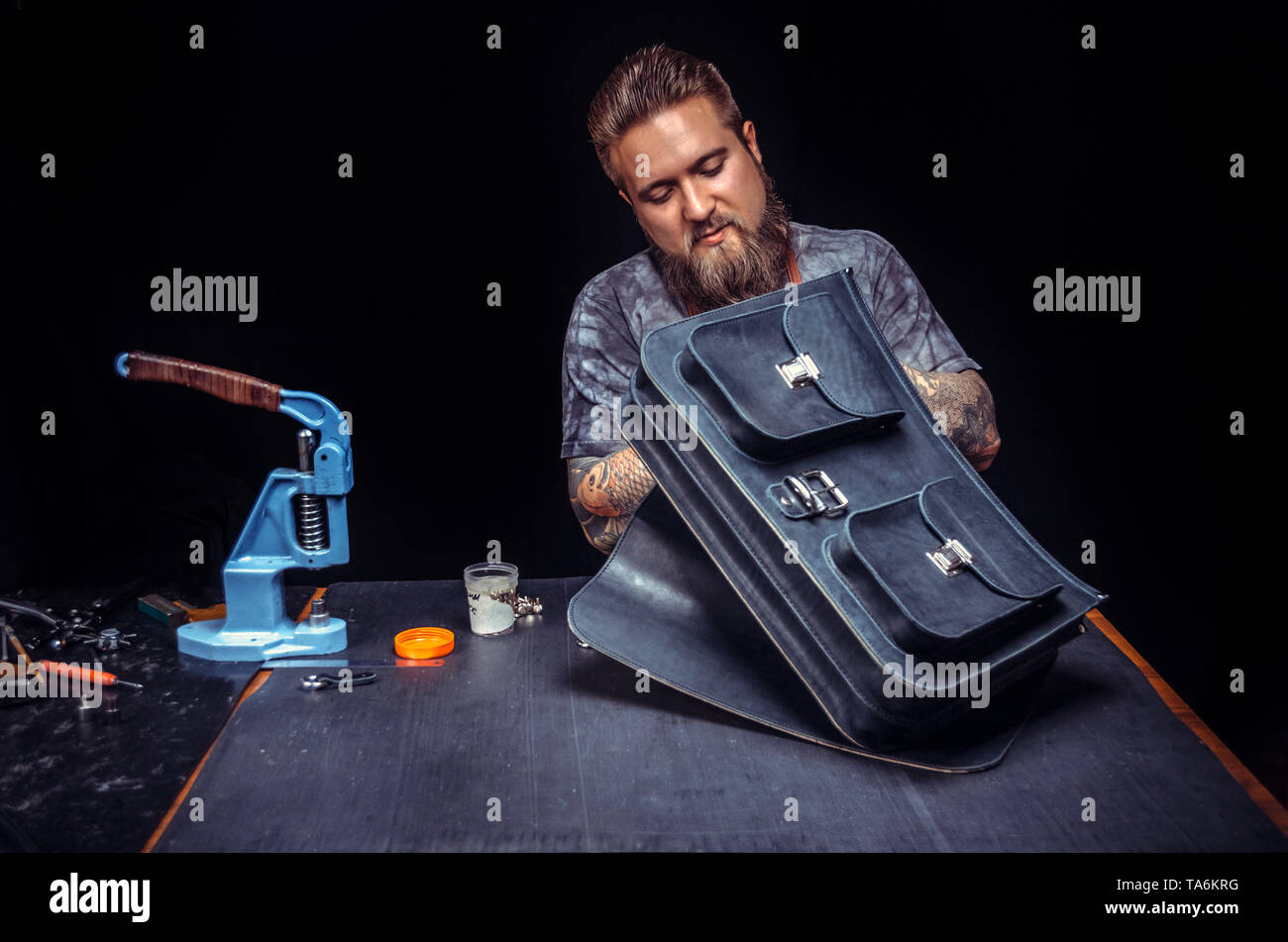 Leather Artist producing leather workpiece in workshop Stock Photo - Alamy