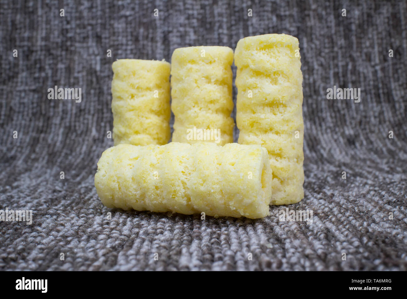 Roller corn snack, snack from corn product Stock Photo - Alamy