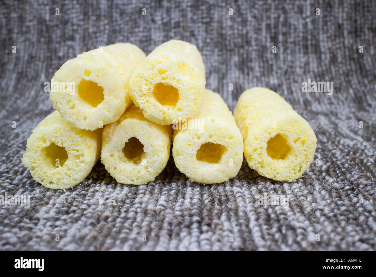 Roller corn snack, snack from corn product Stock Photo - Alamy