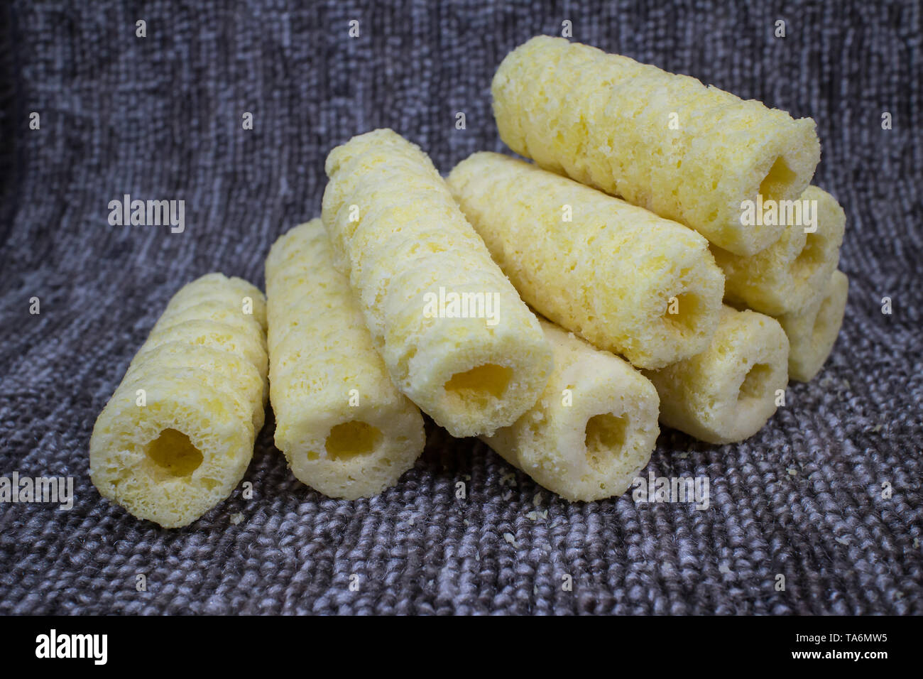 Roller corn snack, snack from corn product Stock Photo - Alamy
