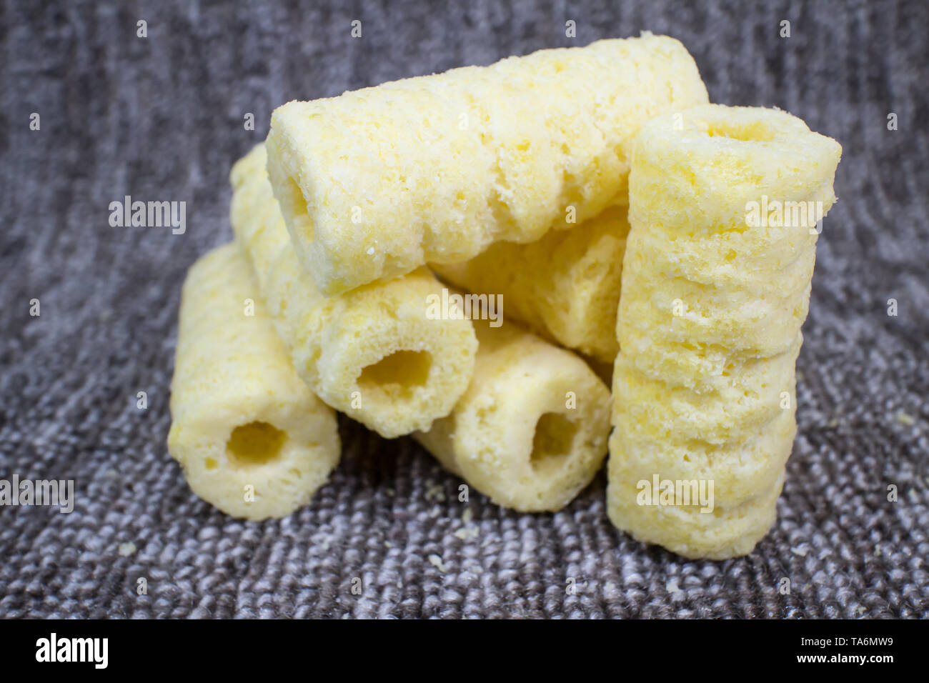Roller corn snack, snack from corn product Stock Photo - Alamy