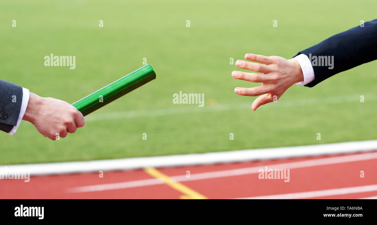 Handover baton in relay race hi-res stock photography and images - Alamy