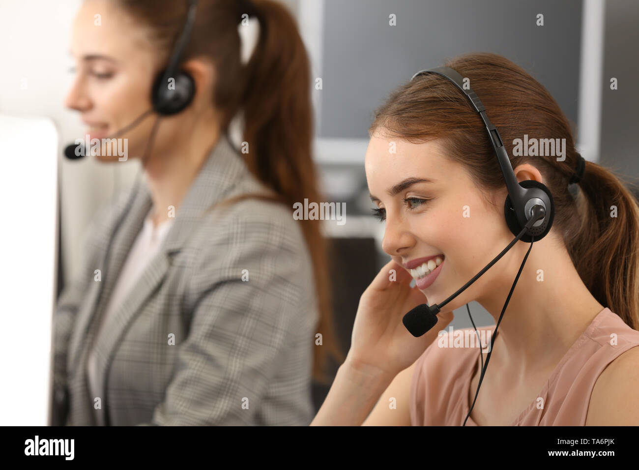 Technical support agents working in office Stock Photo - Alamy