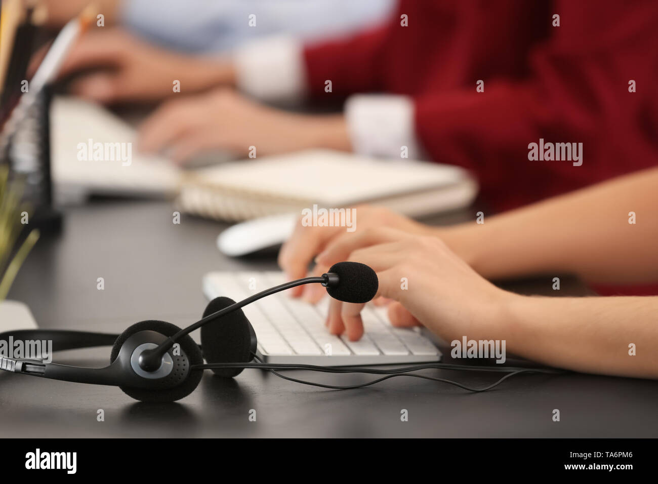Technical support agents working in office Stock Photo - Alamy