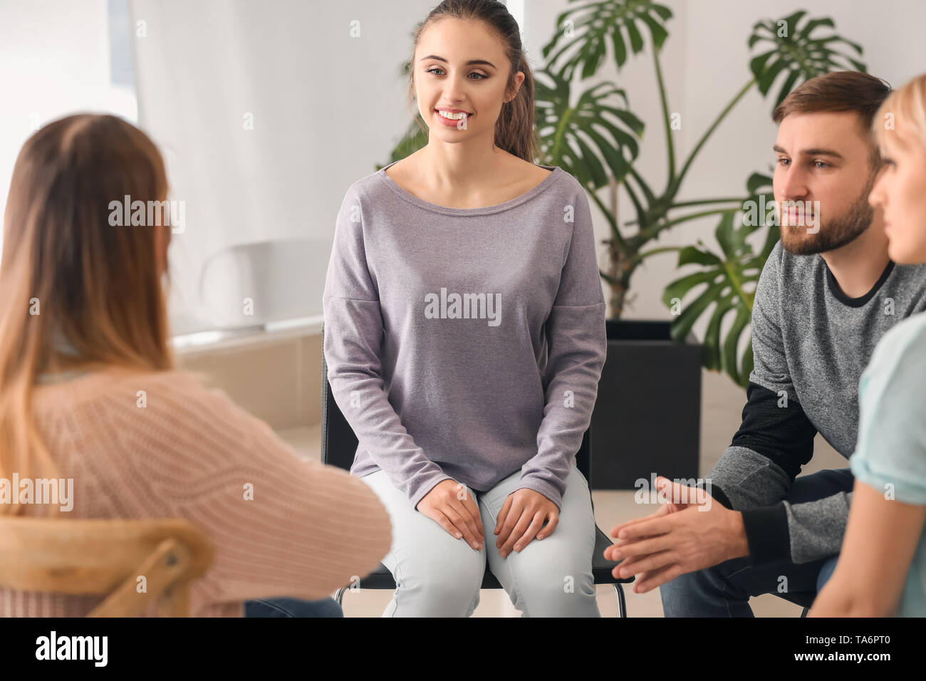 Group of young people meeting indoors Stock Photo - Alamy