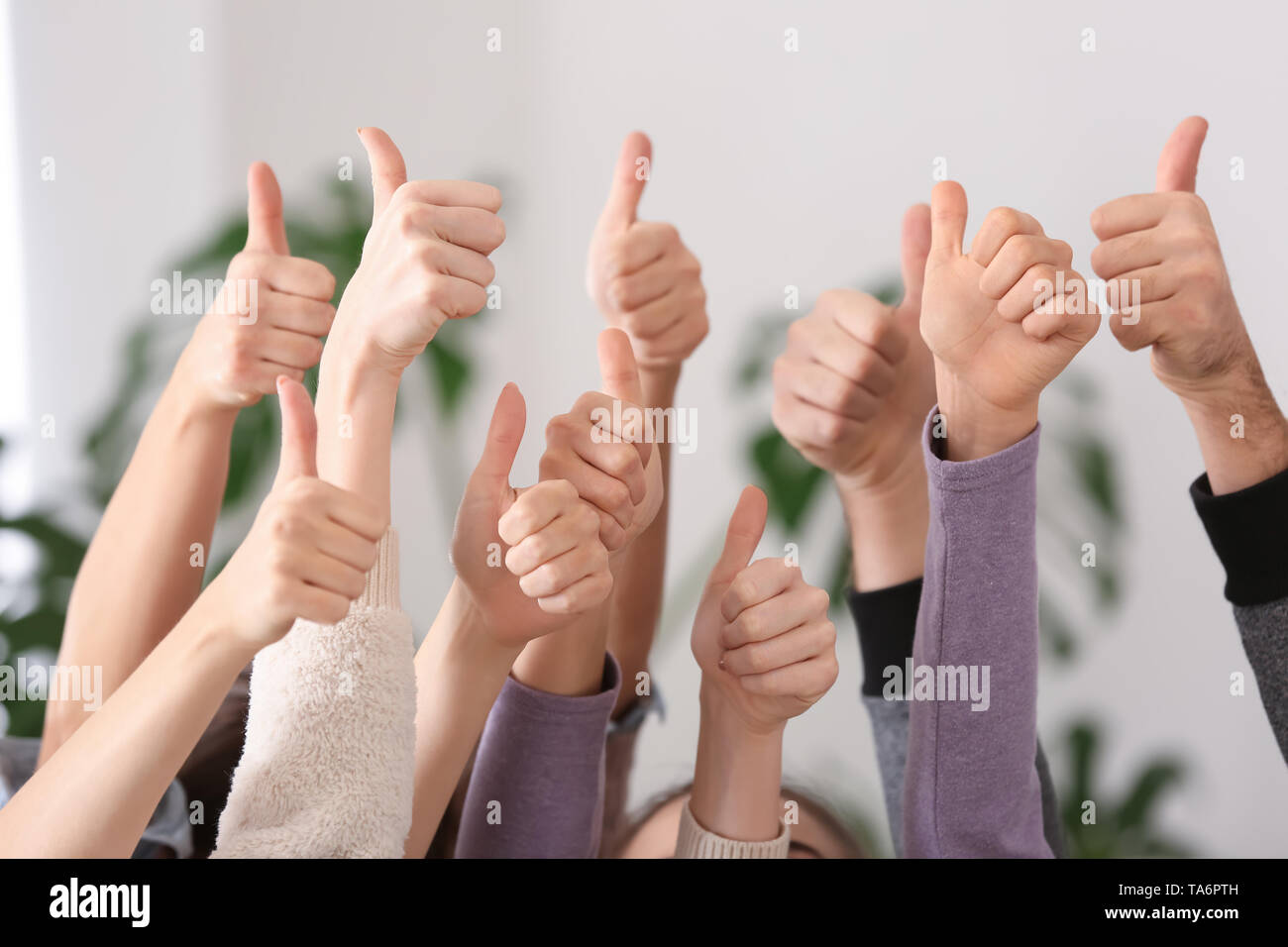 People showing thumb-up gestures as symbol of support Stock Photo - Alamy