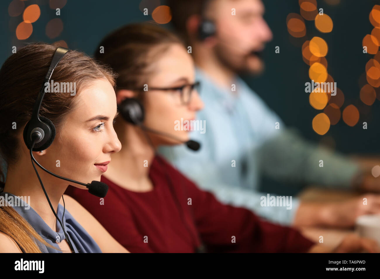 Female technical support agent working in office Stock Photo - Alamy