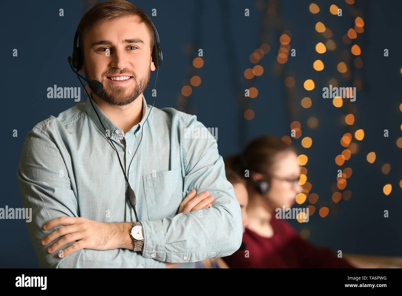 Portrait of male technical support agent in office Stock Photo - Alamy