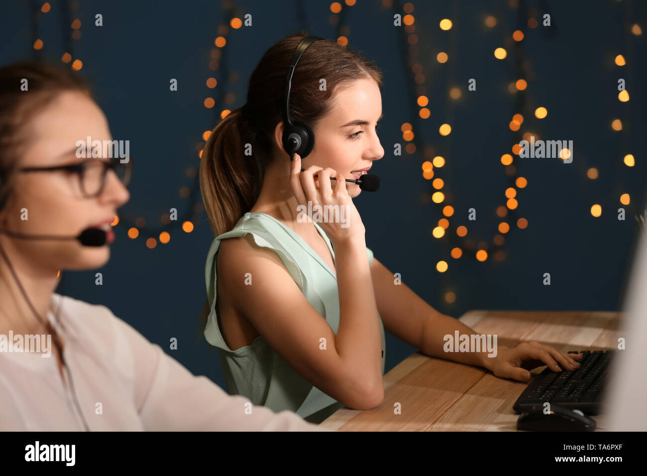 Technical support agents working in office Stock Photo - Alamy