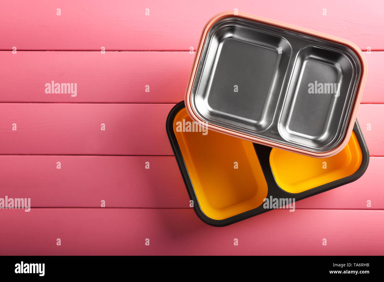Empty school lunch boxes on color wooden background Stock Photo - Alamy