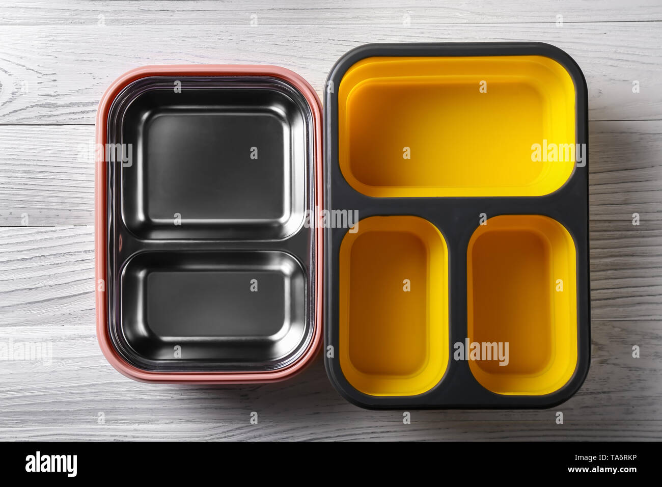 Empty school lunch boxes on wooden background Stock Photo - Alamy