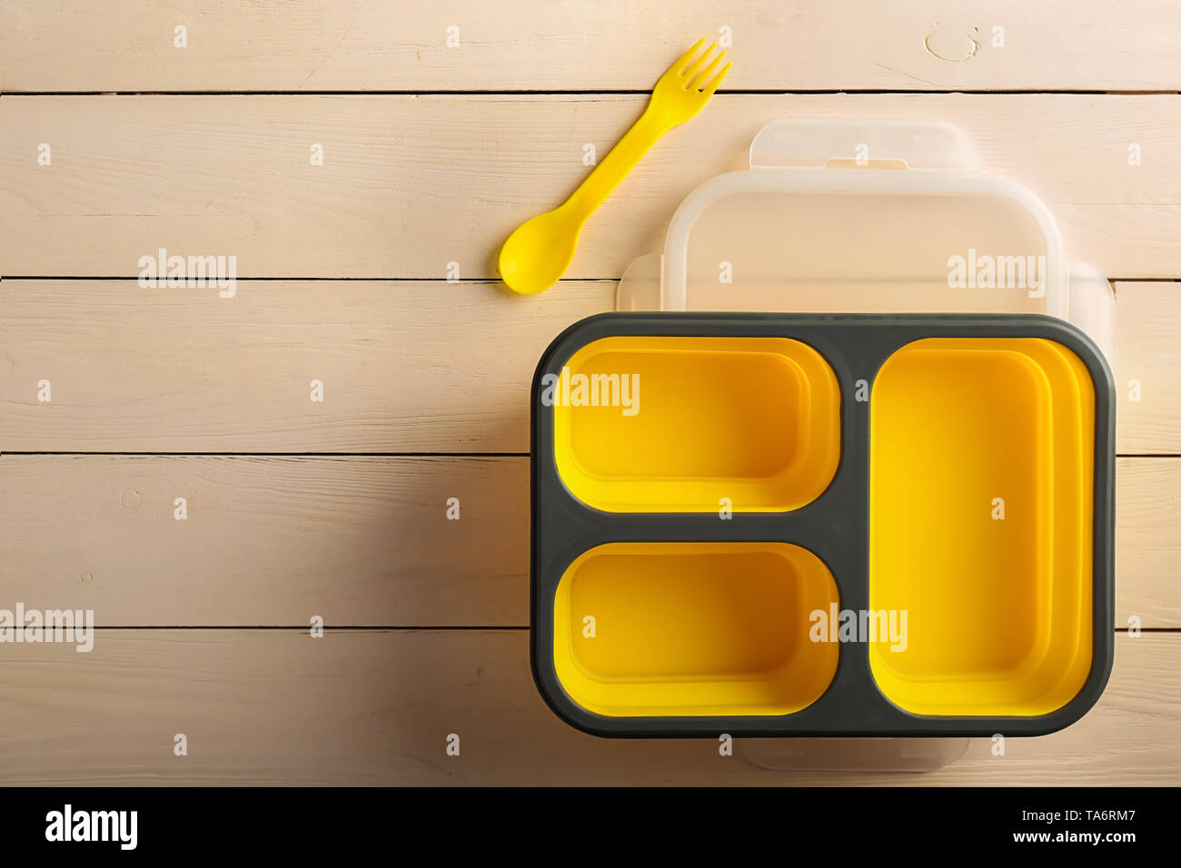 Empty school lunch box on wooden background Stock Photo - Alamy