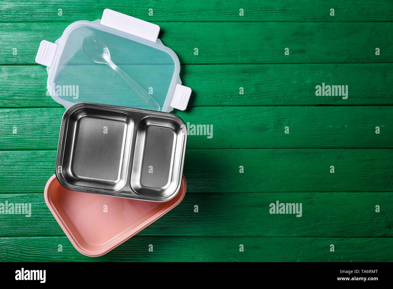 Empty school lunch box on color wooden background Stock Photo - Alamy