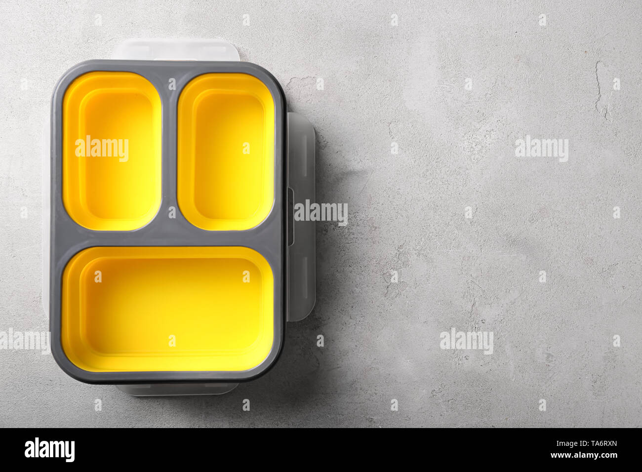 Empty school lunch box on grey background Stock Photo - Alamy