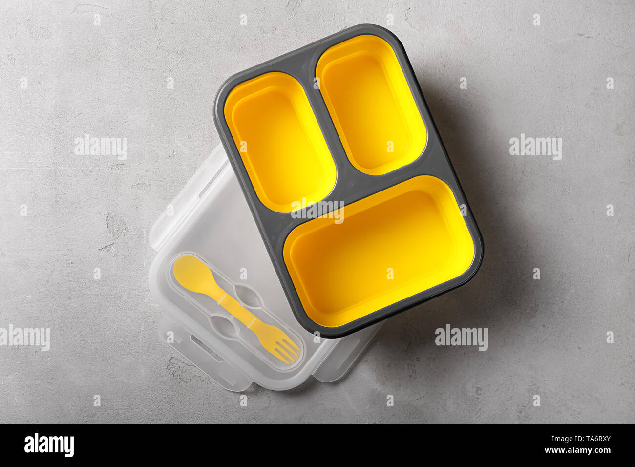Empty school lunch box on grey background Stock Photo - Alamy