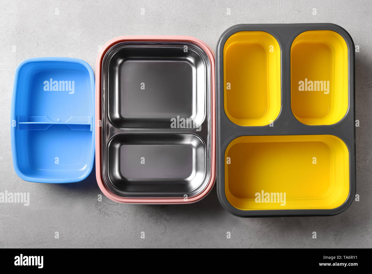 Empty school lunch boxes on grey background Stock Photo - Alamy