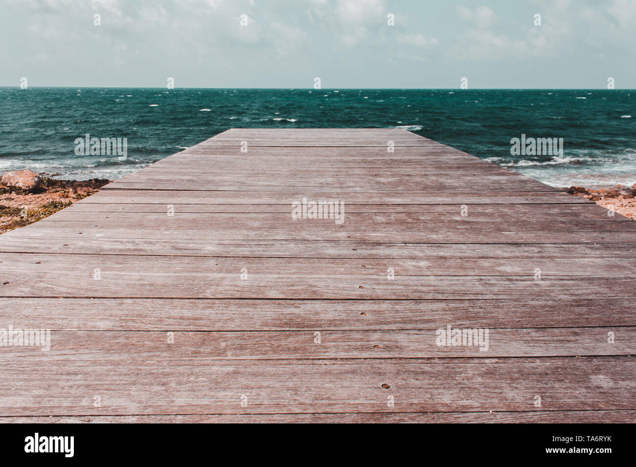 Wooden old bridge, pier, pier in the sea, ocean.Summer background with ...