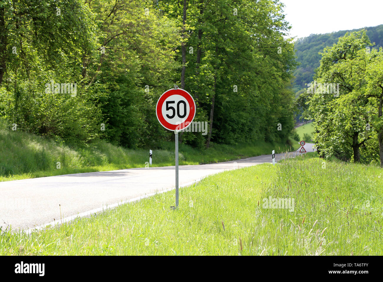 Road signs on snowy highway hi-res stock photography and images - Alamy