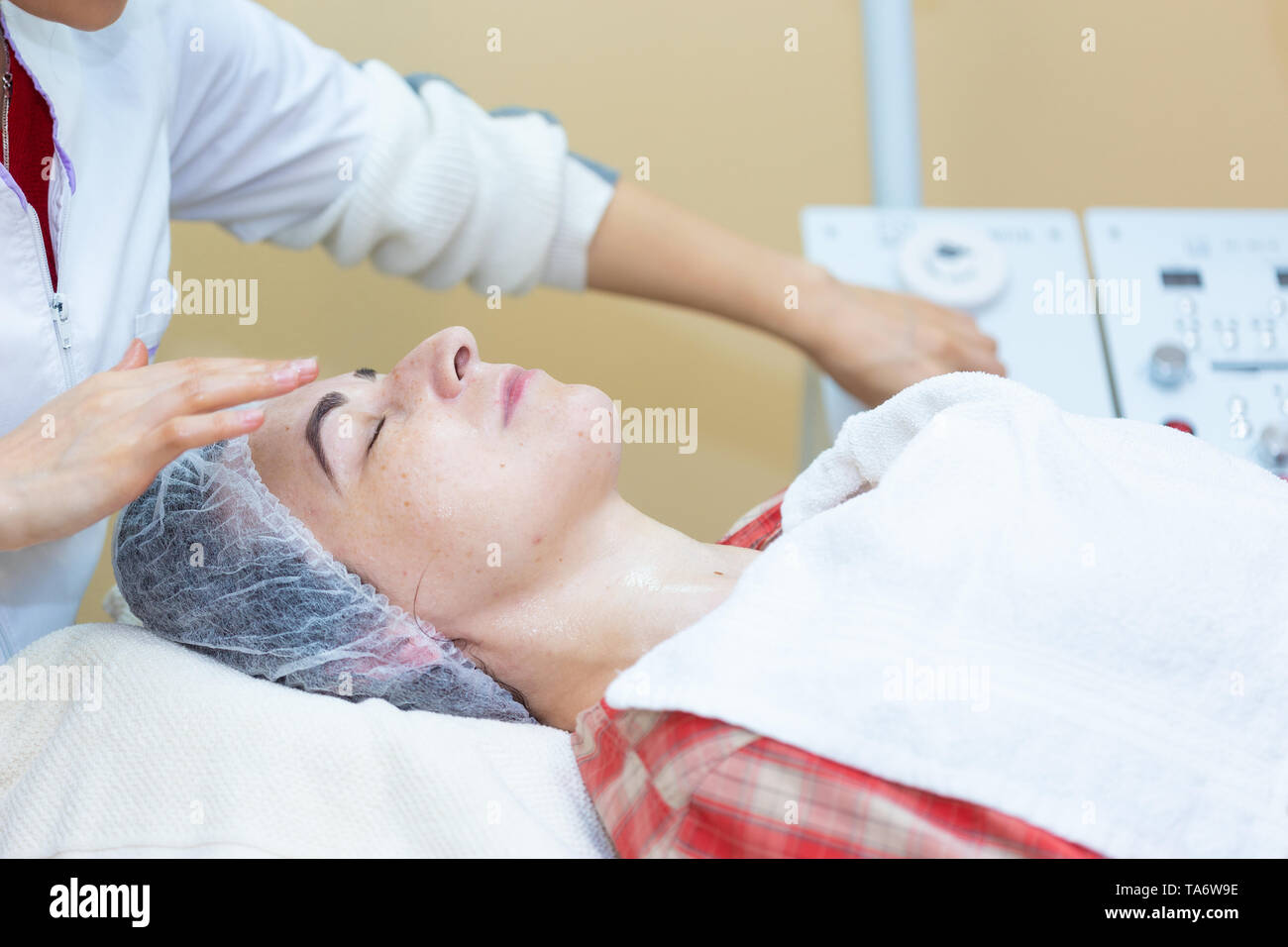 Professional cosmetologist make procedure to beautiful girl in ...