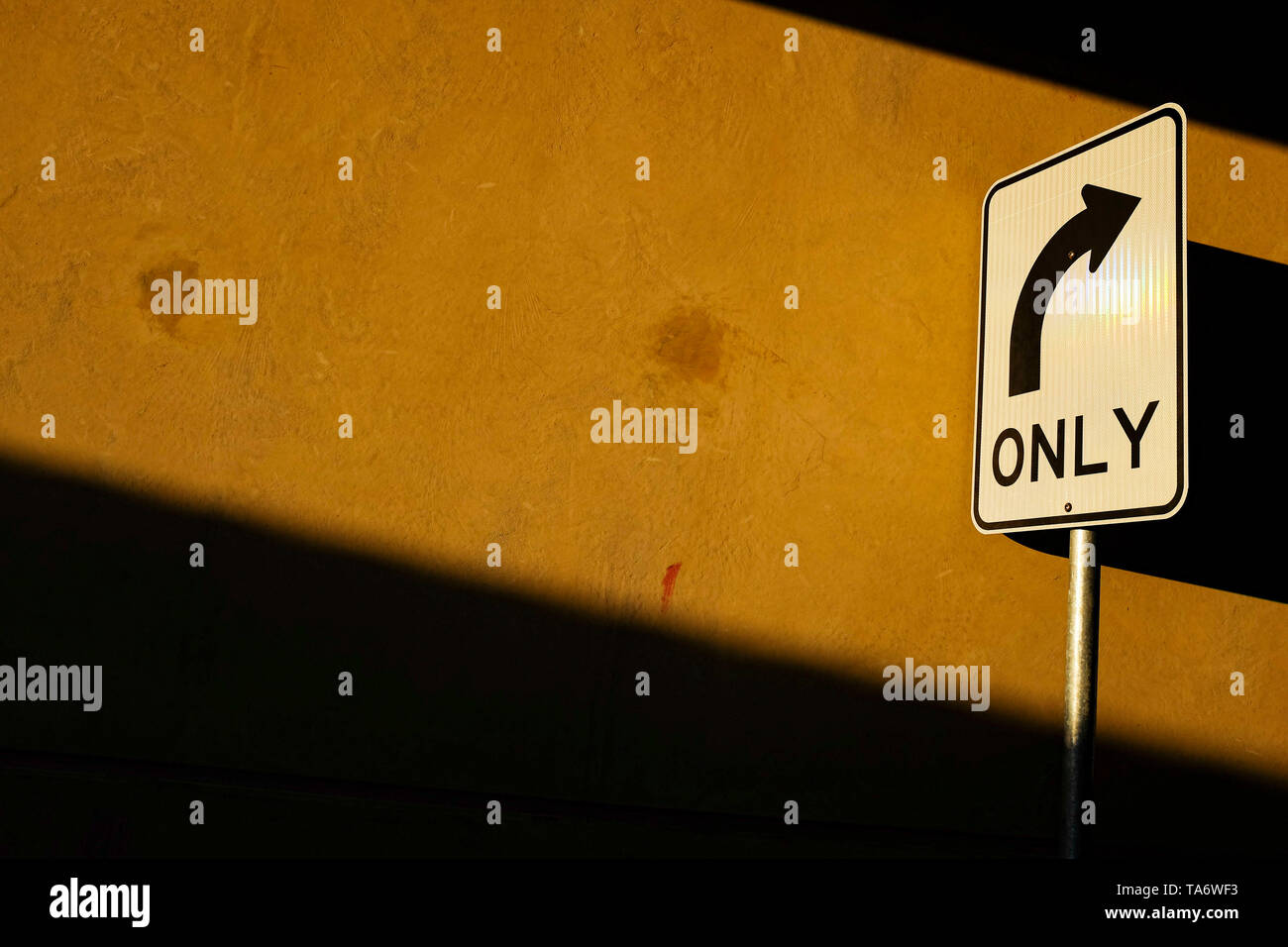 Directional road sign with an arrow symbol and the word only Stock ...