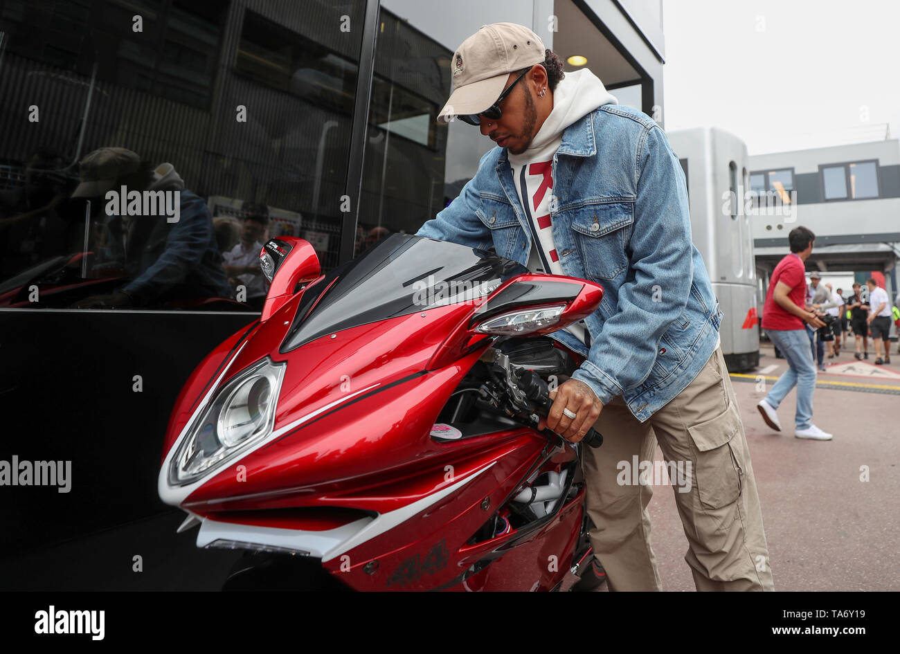 Lewis Hamilton on his motor bike in the paddock at the Circuit de ...