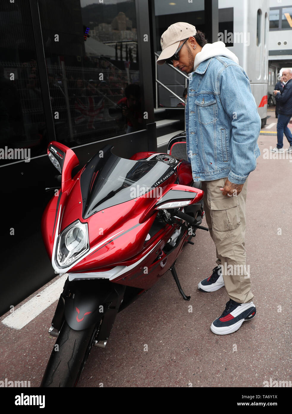 Lewis Hamilton on his motor bike in the paddock at the Circuit de ...