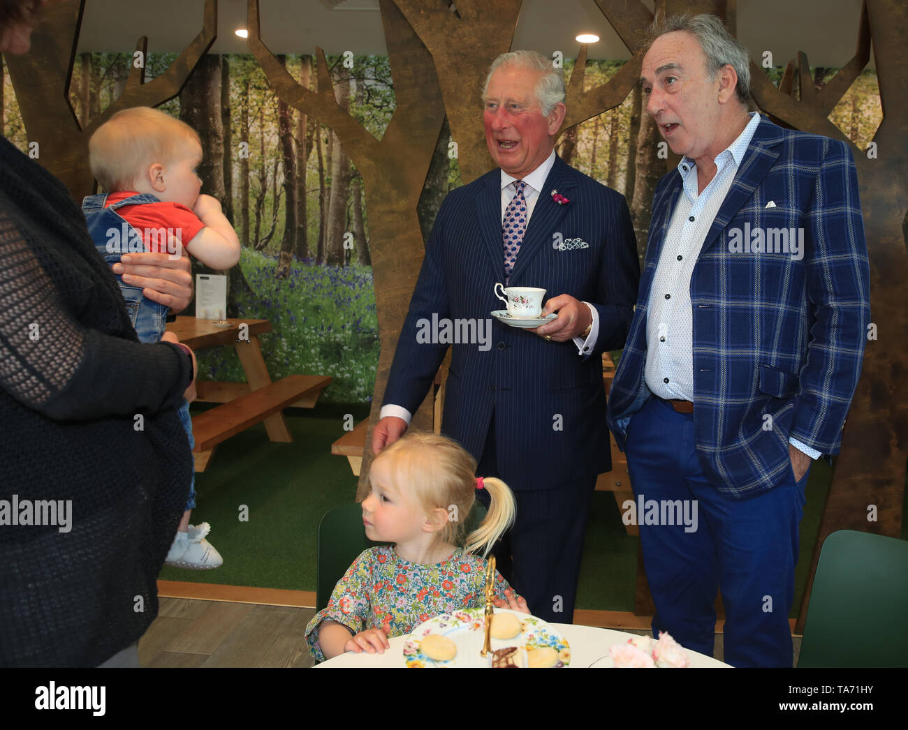 The Prince of Wales meets 9-month-old Margot Dixon, Esme Dixon, 2, and ...