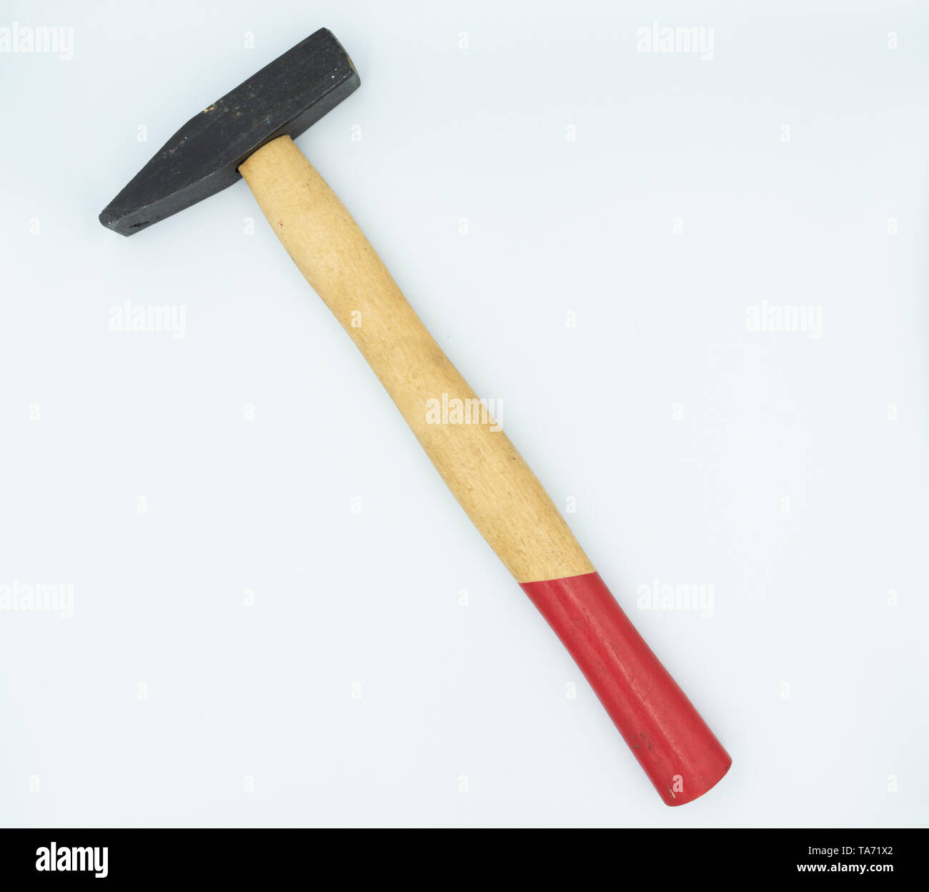 This is capture of a red and beige hammer on a white background and in ...