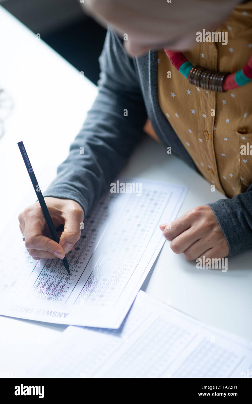 Teacher checking paper hi-res stock photography and images - Alamy