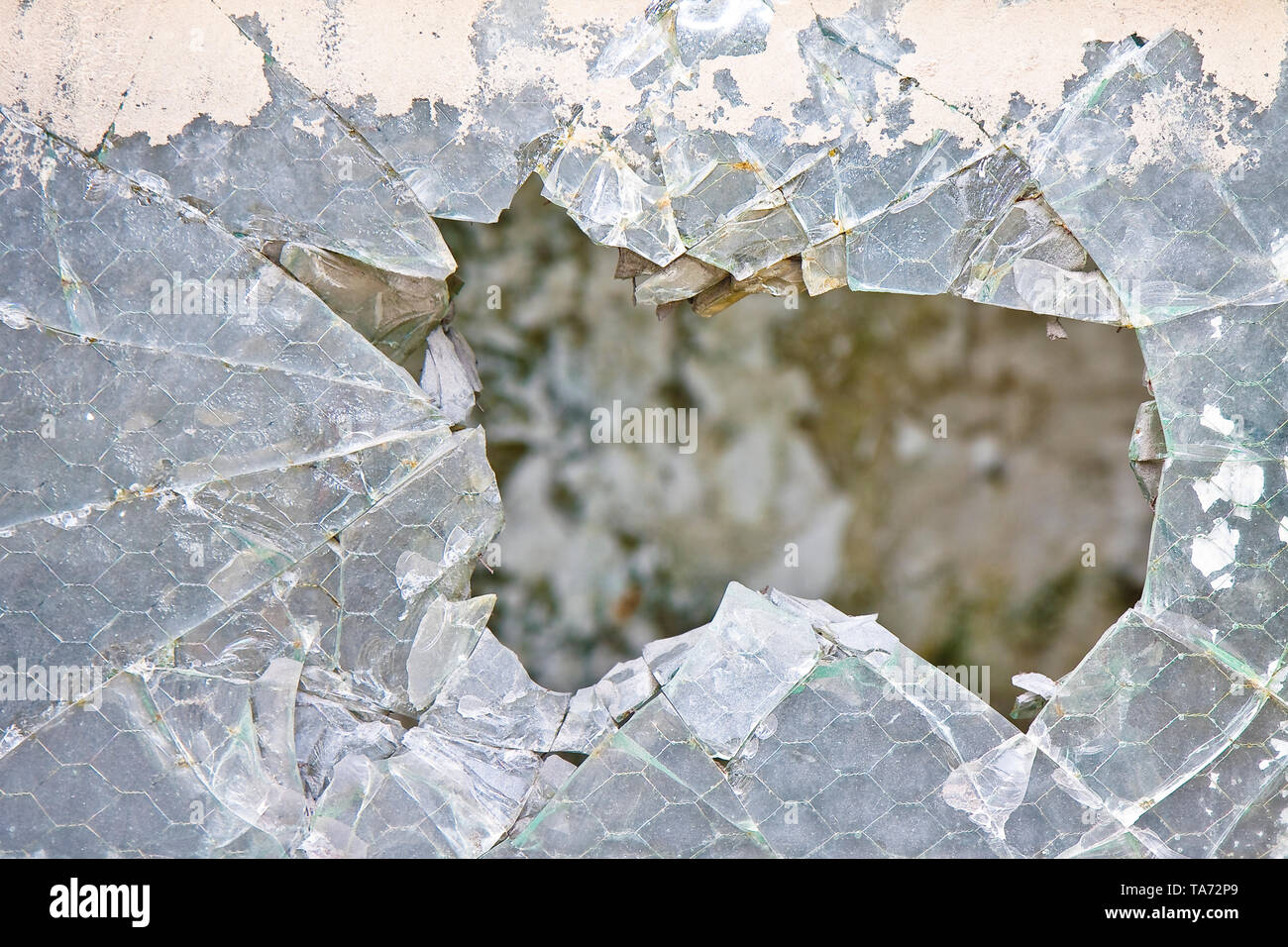 Old damaged glass reinforced with wire mesh Stock Photo - Alamy
