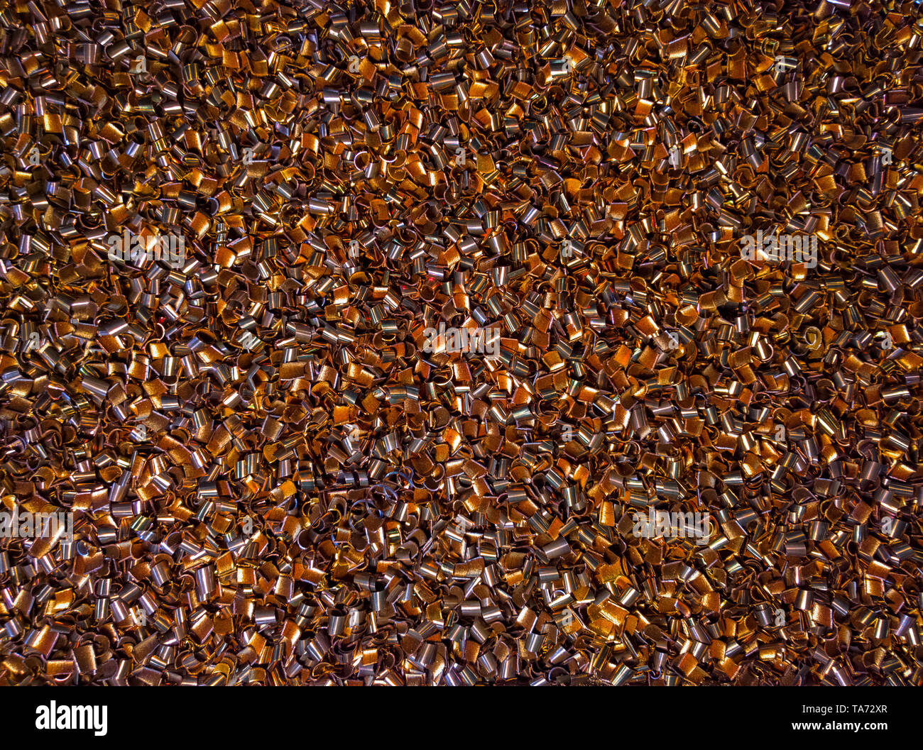 Brass chips flat closeup textured background Stock Photo - Alamy