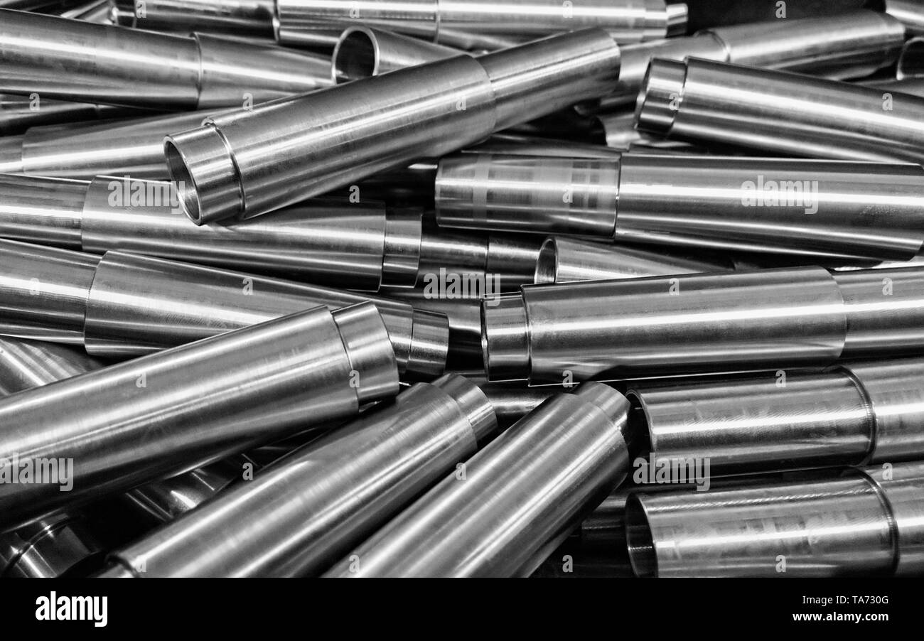 steel cnc-turned raw surface pipes closeup industrial background Stock ...