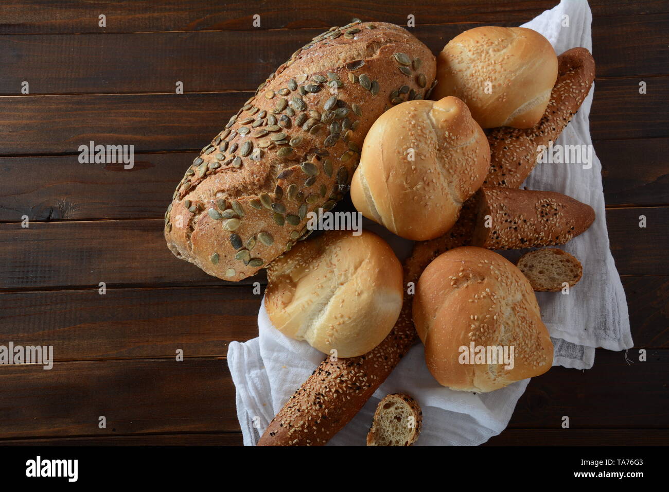 Bakery. Fresh fragrant baked bread. Homemade bread on wooden background ...