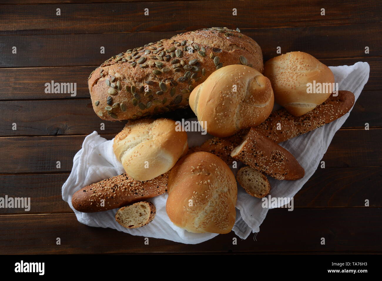 Bakery. Fresh fragrant baked bread. Homemade bread on wooden background ...