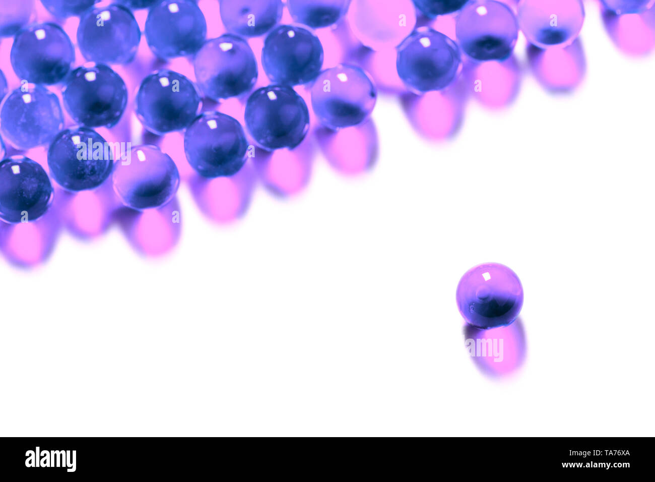 proton purple spherical ball capsules with selective focus isolated on ...