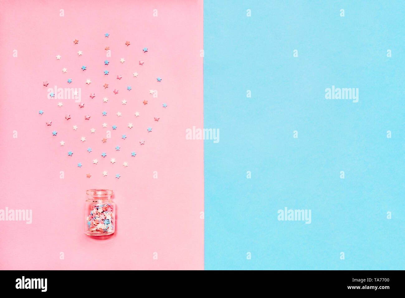 Little stars confetti on pink background. Holyday concept. Copy cpase ...