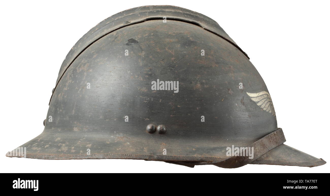 A helmet for air-raid protection members adapted from a French "Adrian ...