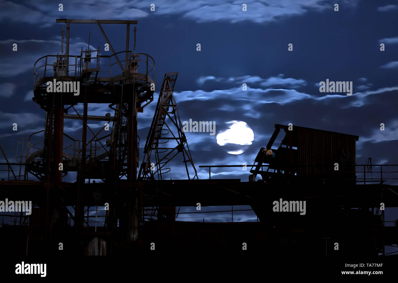 silhouette of old factory in the moonlight night Stock Photo - Alamy