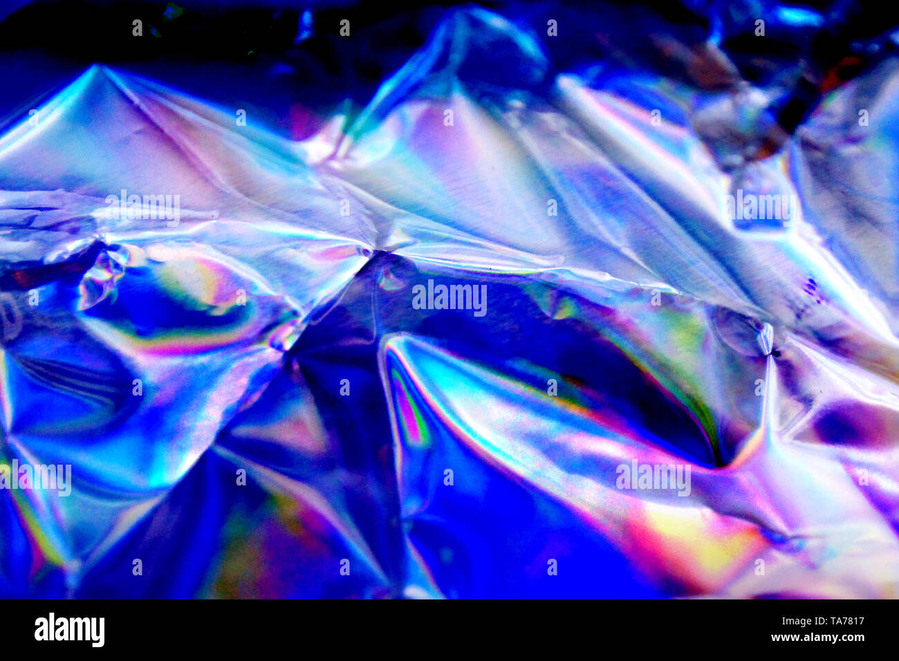 Holographic iridescent foil texture background. It can be used for ...