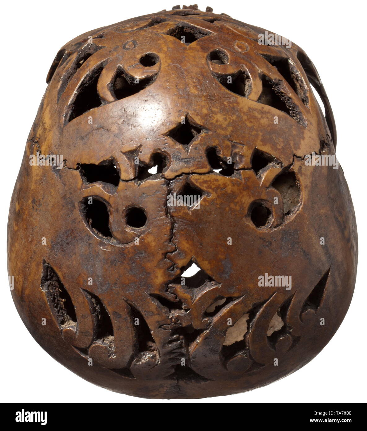 A trophy skull of the Dayak people, Borneo Elaborately carved skull ...