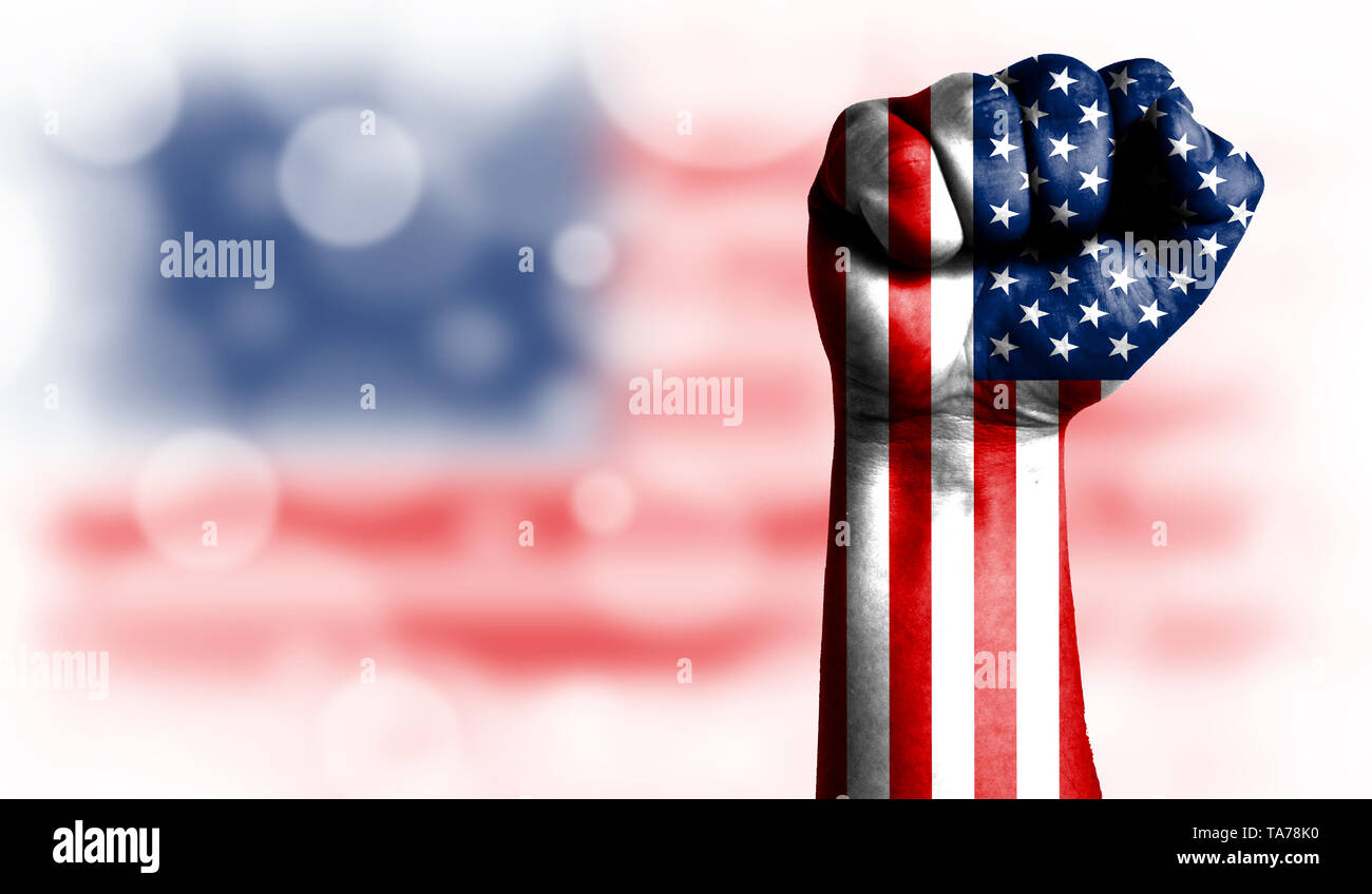 Flag of America painted on male fist, strength,power,concept of ...
