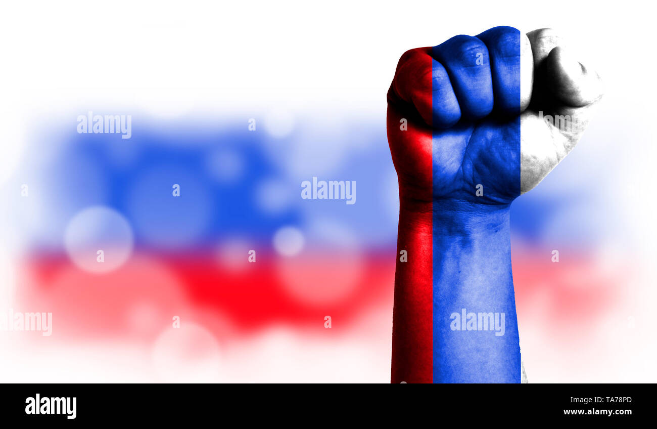 Flag of Russia painted on male fist, strength,power,concept of conflict ...