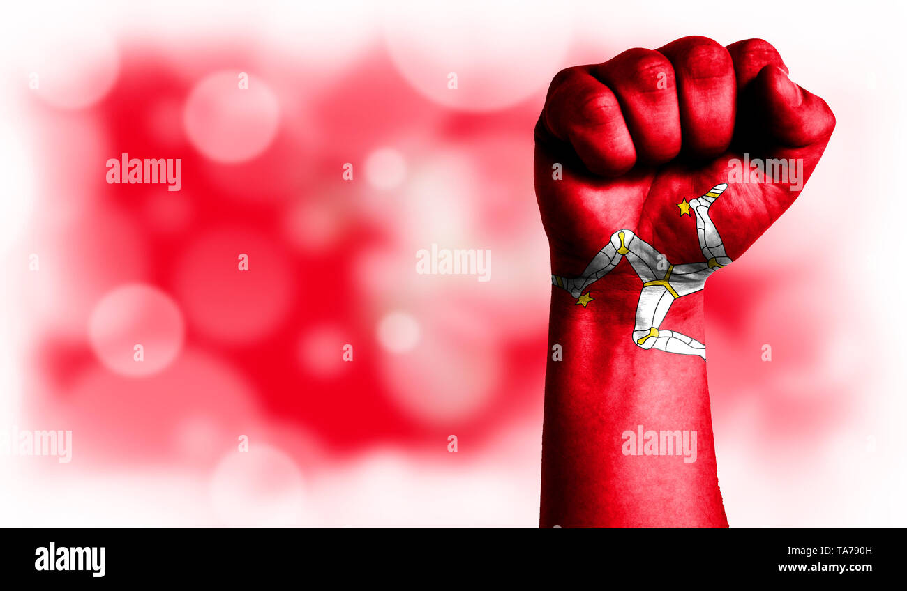 Flag of Isle Of Man painted on male fist, strength,power,concept of ...