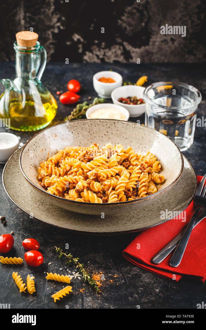 Pasta fusilli with bolognese tomato beef sauce. Traditional italian ...